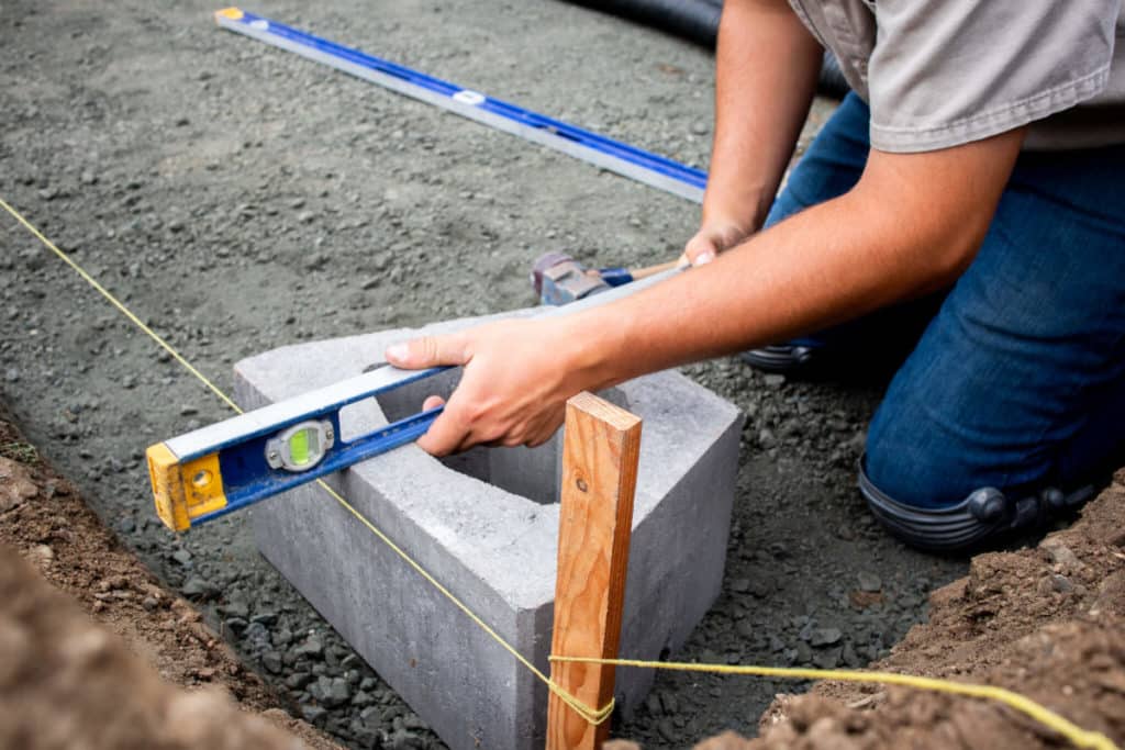 How to Build a Retaining Wall at Home | Western Interlock | DIY