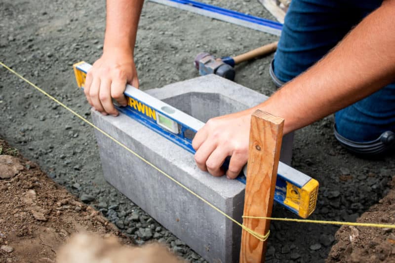 How to Build a Retaining Wall at Home | Western Interlock | DIY