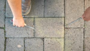 Next, pry the stone up by pushing the screwdrivers in an outward motion ...