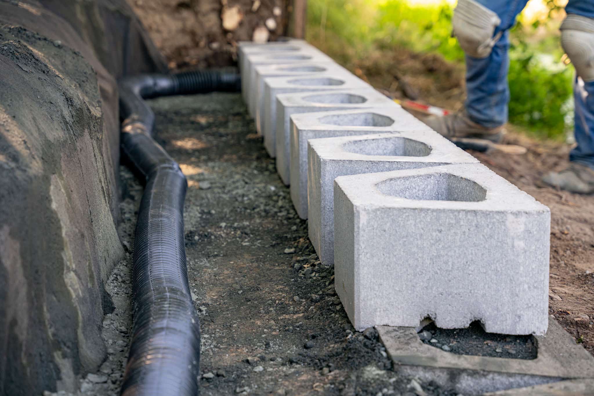 How to Retain a Steep Slope with Retaining Wall Blocks | DIY