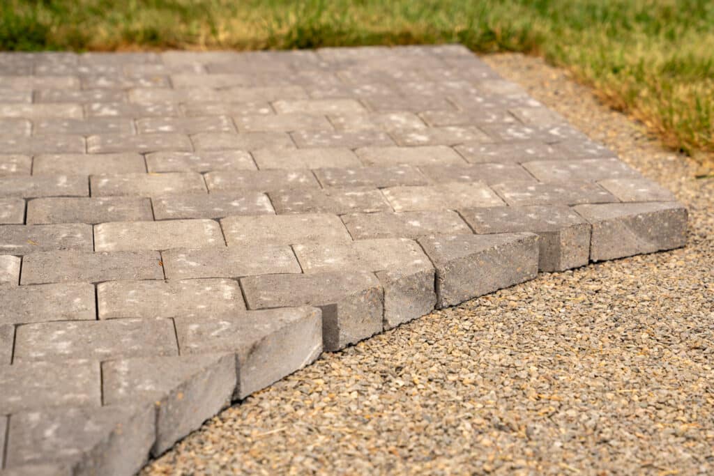 How to Cut a Curved Edge in a Paver Walkway or Patio Landscape | DIY